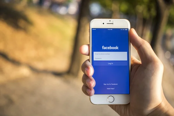 CHIANG MAI, THAILAND - JANUARY 04, 2015: A man trying to log in ...