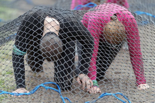 Crawling under the super net trap at Tough Viking obstacle cours ...