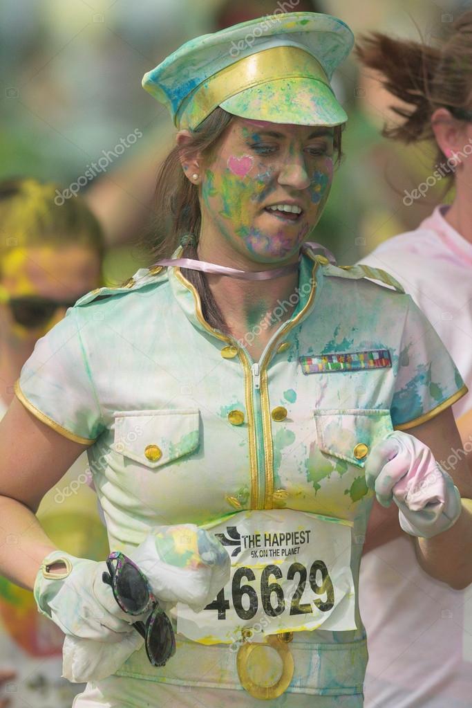 Female runner in costume between the color stations at Color Run ...