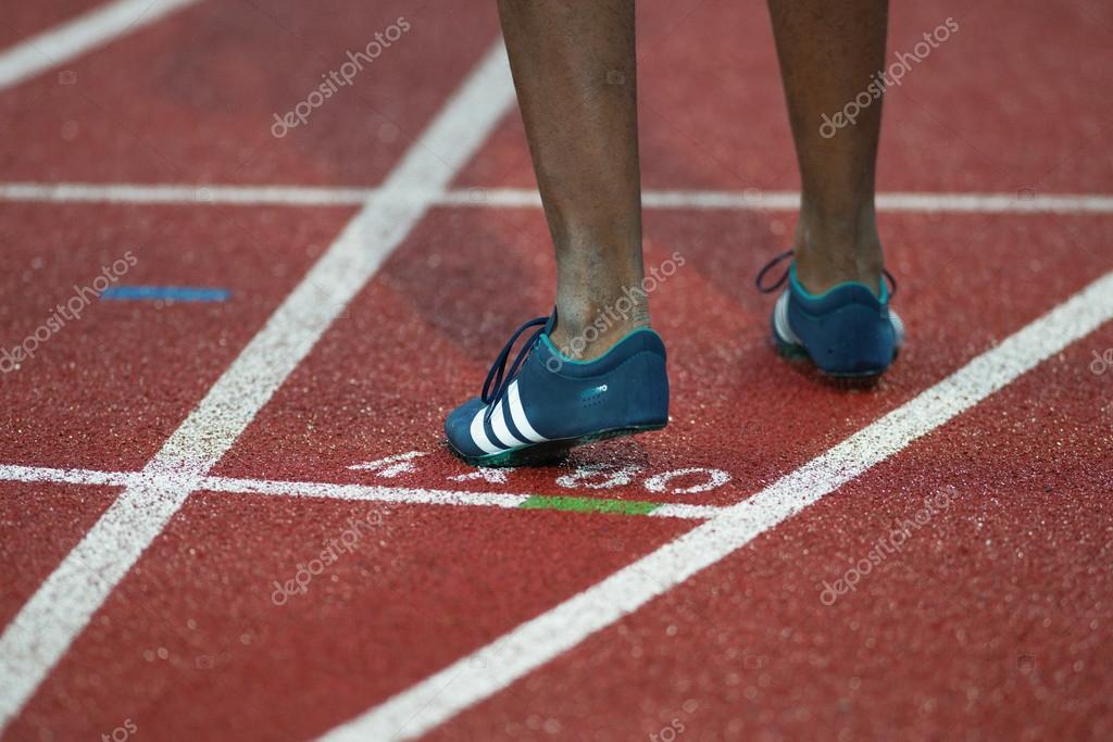Shoe of an athlete sprinter on a track and field start at the IA ...