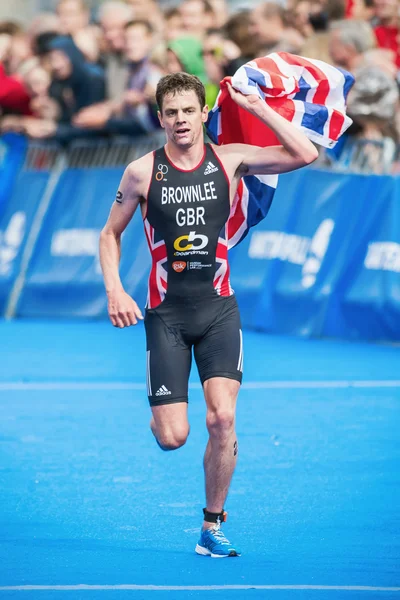 Winner Jonathan Brownlee crossing the finish line and win the Me ...