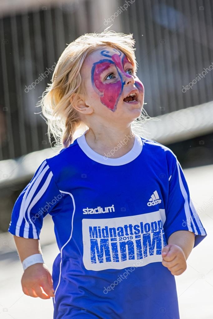 Distracted young girl with face painting at the Minimil for the – Stock ...