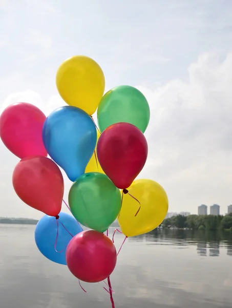 Balloons floating in swimming pool. — Stock Photo © poznyakov #6724124