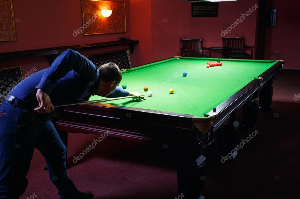 Man aiming the billiard ball Stock Photo by ©serkucher 107883388
