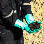 Oil sands development from an oil drilling district. The hand on the ...