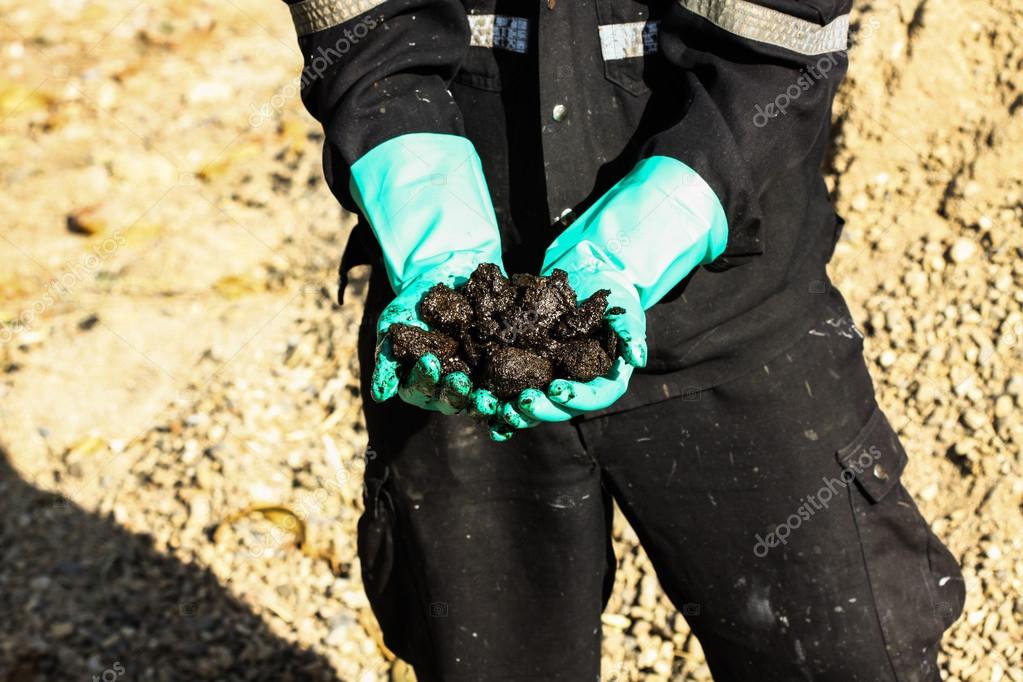 Oil sands development from an oil drilling district. The hand on the ...