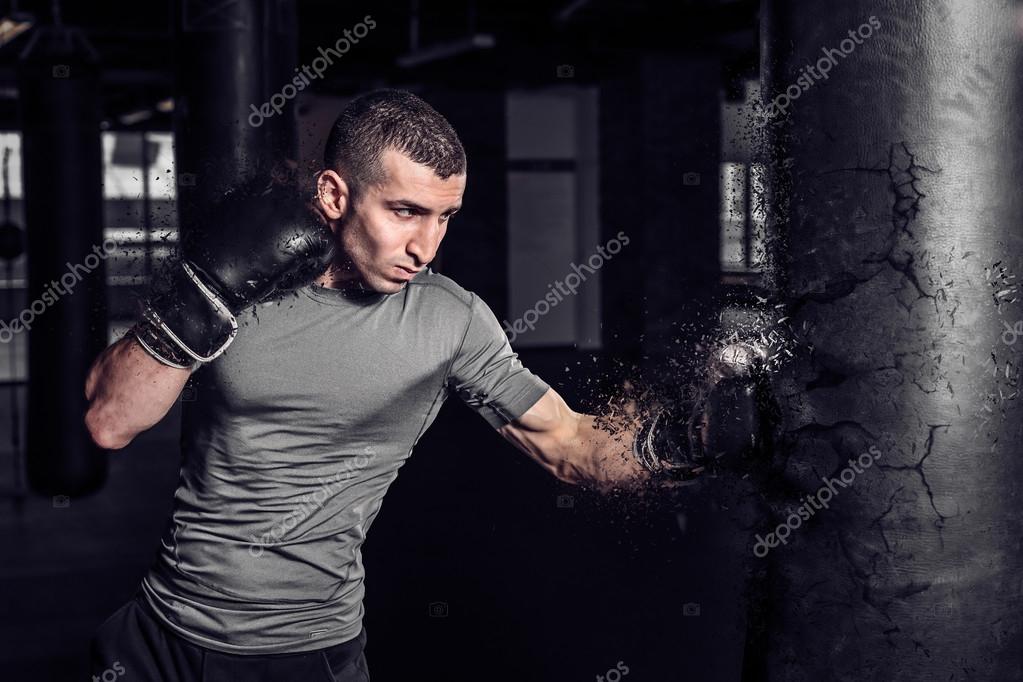 Boxer punch punching bag exploding in gym Stock Photo by ©ivanriver ...