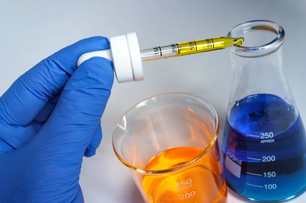 Close up glass measuring beaker for science experiment background ...