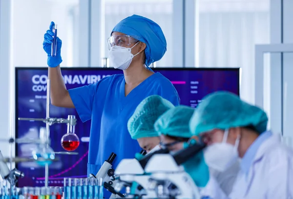 Group of female researchers or scientists wearing protective hygiene ...