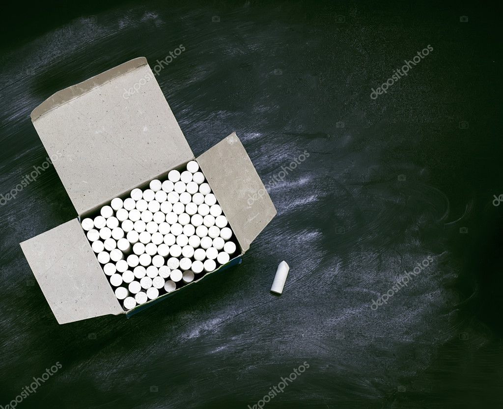 Box with pieces of chalk on a blackboard — Stock Photo © modusviv ...