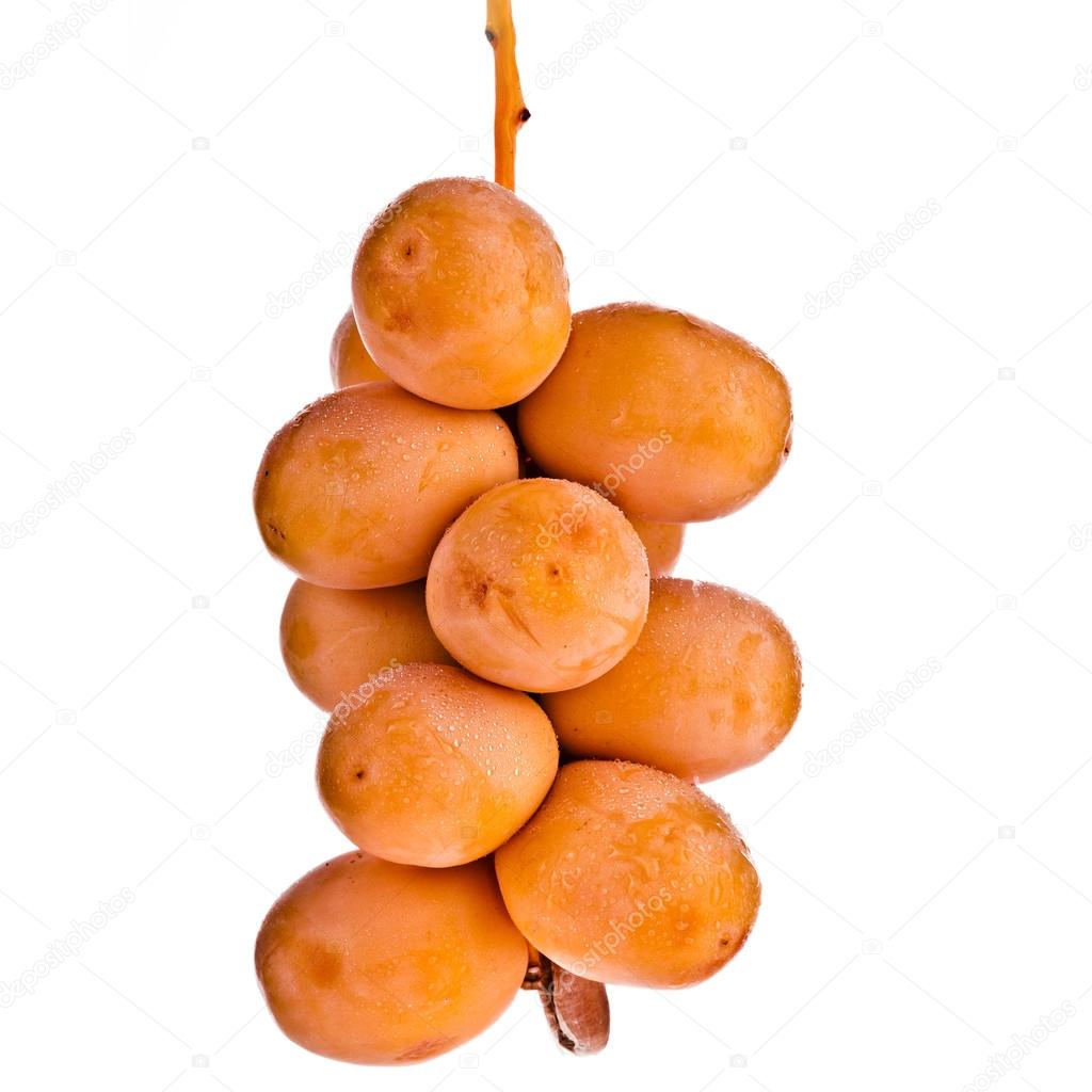 Bunch of yellow raw dates fruit — Stock Photo © Madllen #58791201