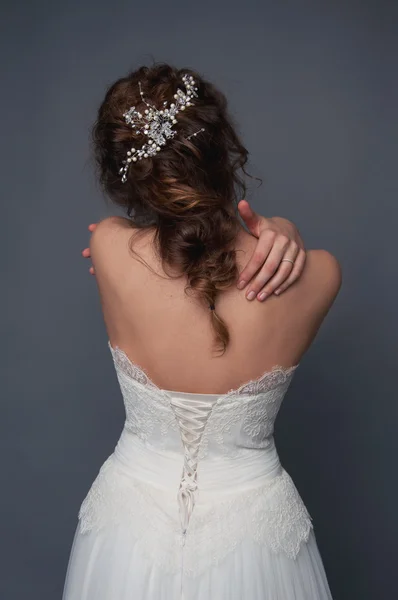 Bridal fashion. Brunette bride view from the back. - Stock Image ...