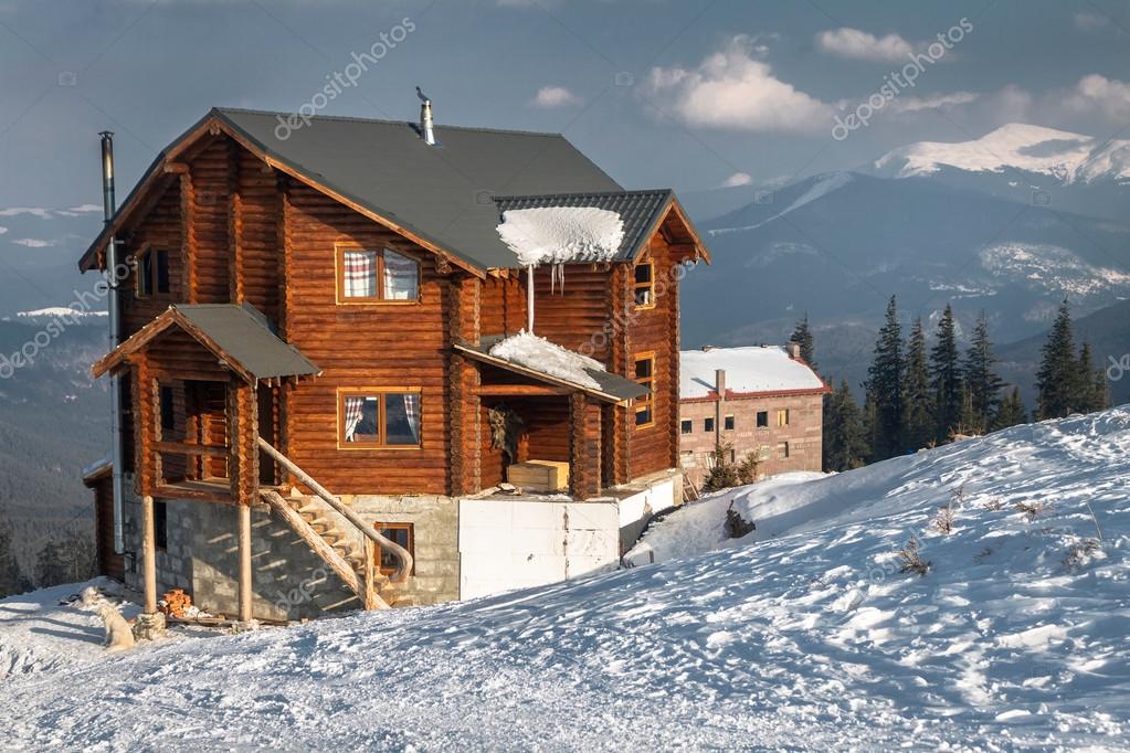 Snow-covered cottage in the mountains — Stock Photo © alexabelov #63654477