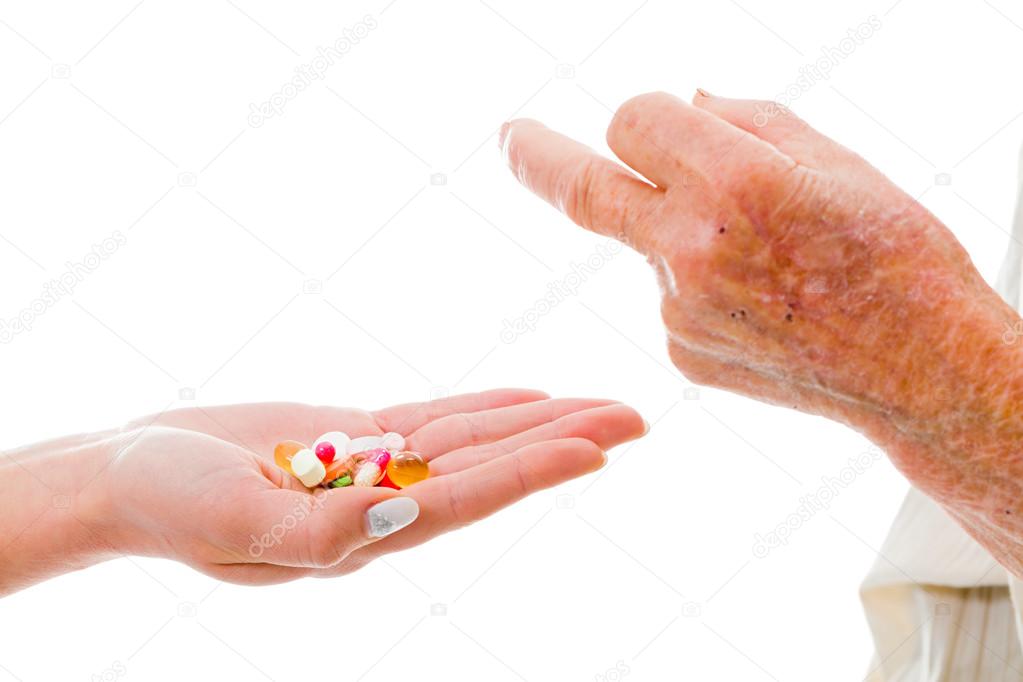 Elderly woman refusing medications with a rude gesture Stock Photo by ...