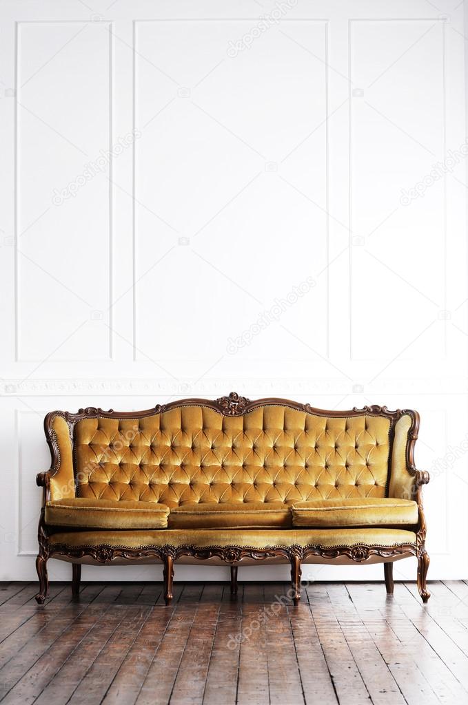 Ancient sofa in a retro interior — Stock Photo © shmeljov #105125528