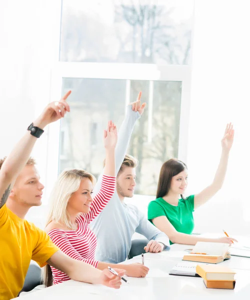 Students raising hands Stock Photos, Royalty Free Students raising ...