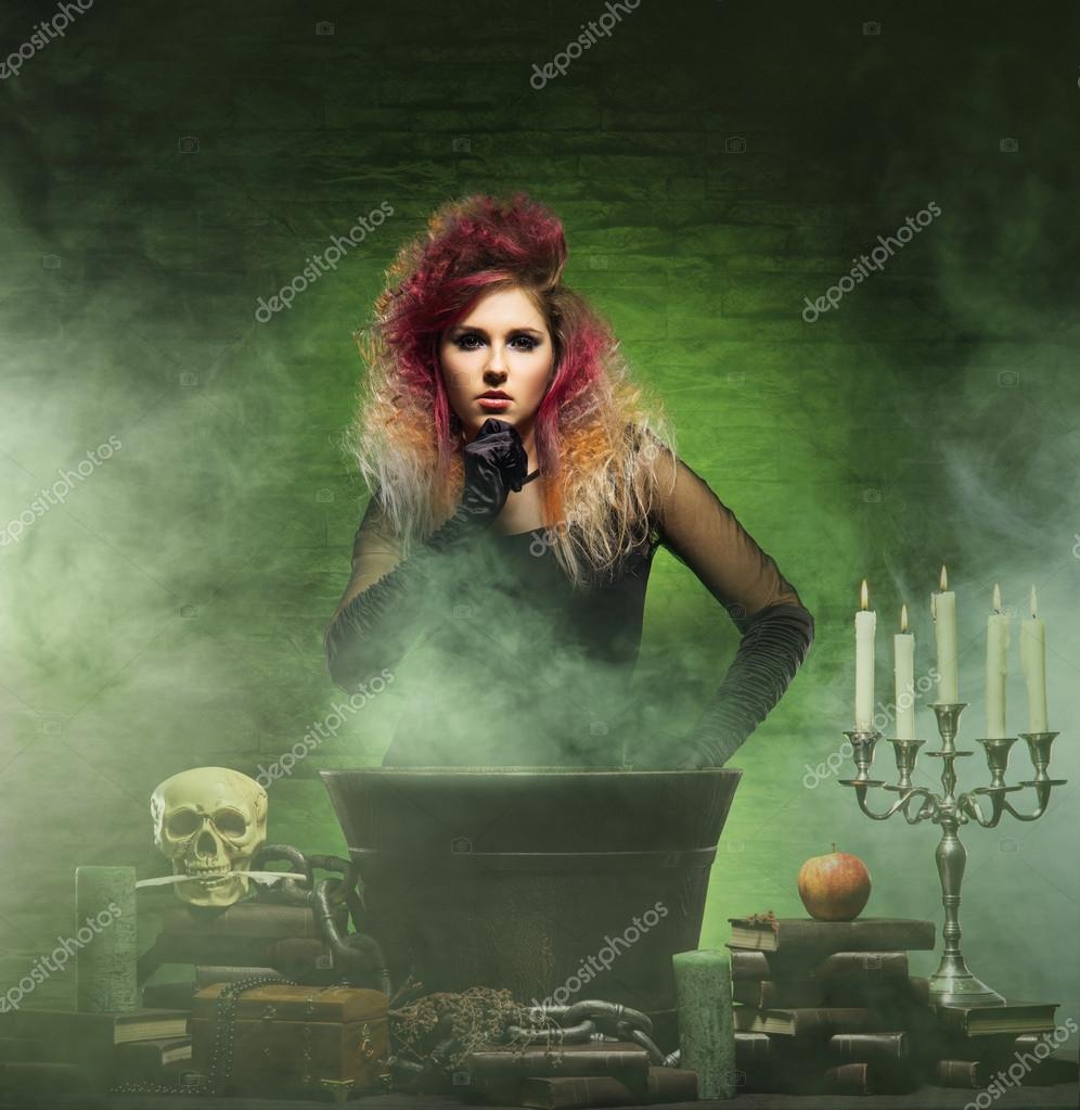 Witch conjuring in a dungeon Stock Photo by ©shmeljov 85982562