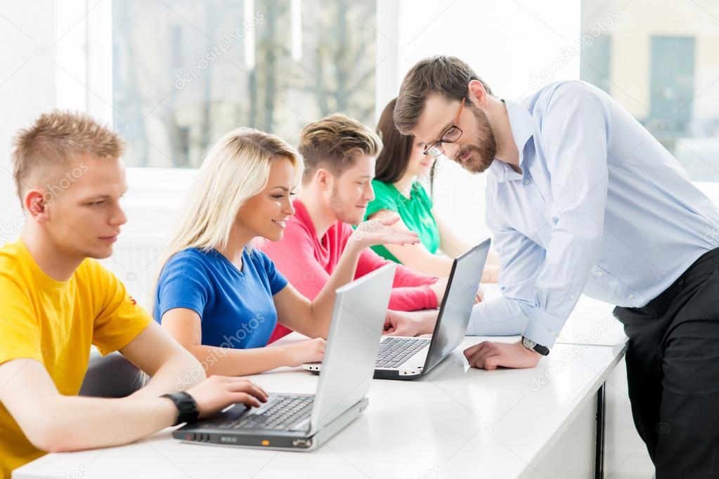Students studying at the lesson in the classroom — Stock Photo ...