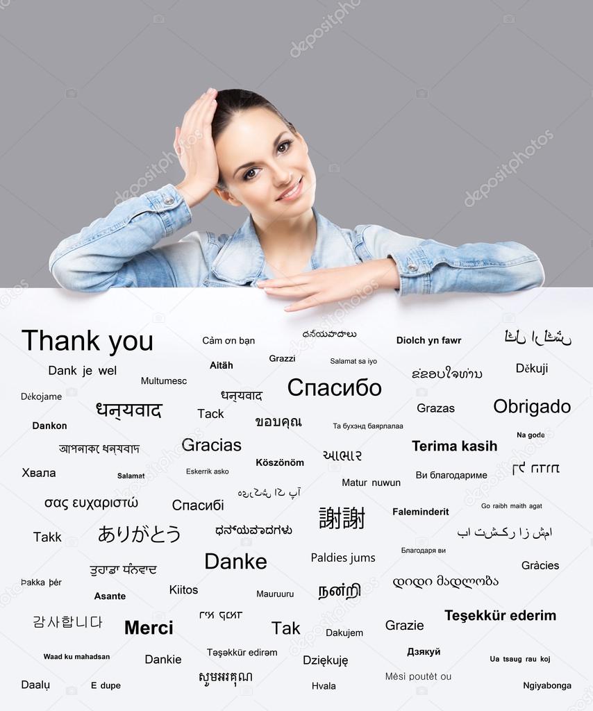 Beautiful girl with a banner of world's different languages Stock Photo ...
