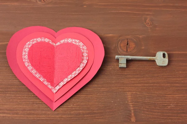 'Key to My Heart' love concept, with gold heart shape key and red heart ...