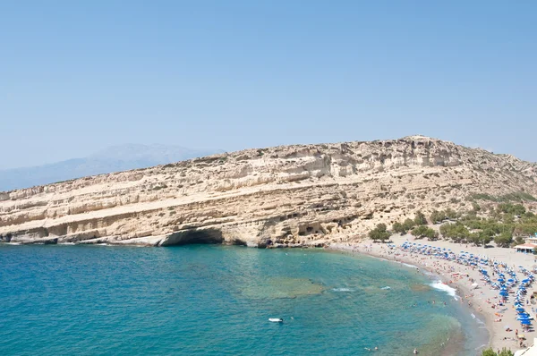 Famous Matala hippy beach with caves on the Crete island, Greece ...