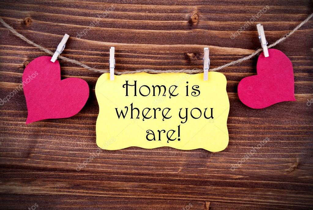 Yellow Lable Saying Home Is Where You Are — Stock Photo © Nelosa #58539583