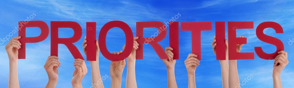 Hands Hold Red Straight Word Priorities Blue Sky — Stock Photo © Nelosa ...