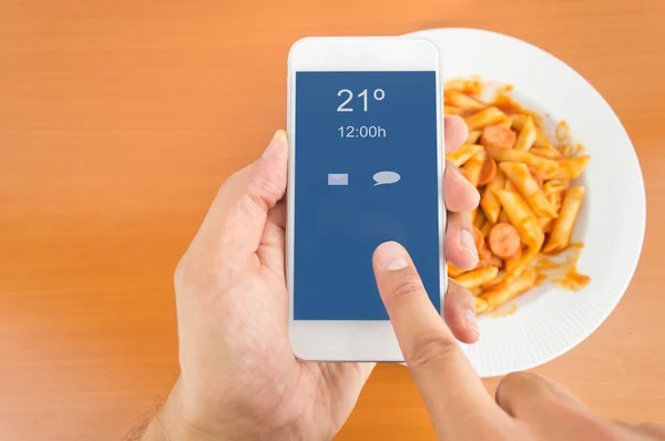 using my smartphone at the dinner time - Stock Image - Everypixel