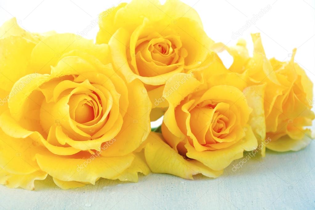 Beautiful yellow roses on rustic wood table. — Stock Photo © amarosy ...