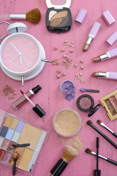Makeup Items on Vintage Pink Wood Table - Stock Image - Everypixel