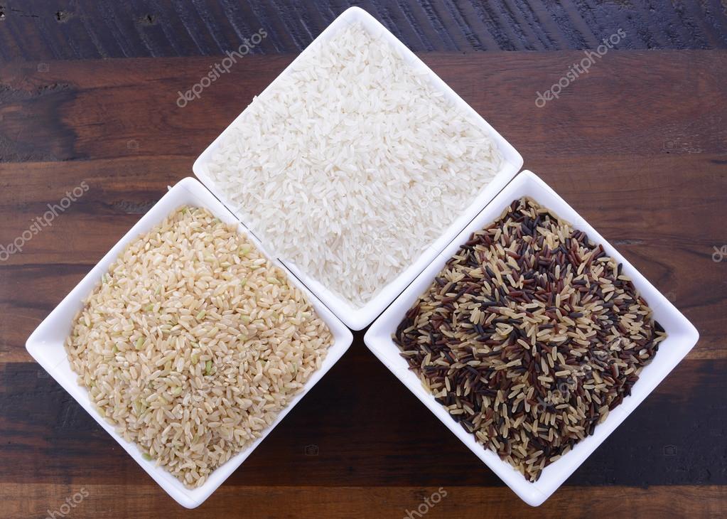Square bowls of uncooked rice — Stock Photo © amarosy #86306962