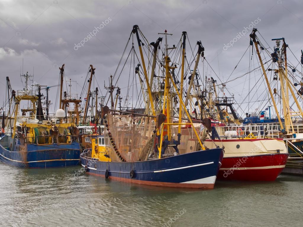 Fishing boats in harbour — Stock Photo © CreativeNature #105981084