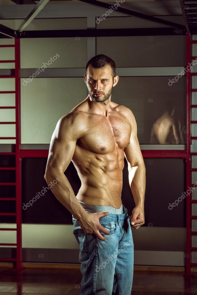Man posing in jeans Stock Photo by ©ozimicians 70835853