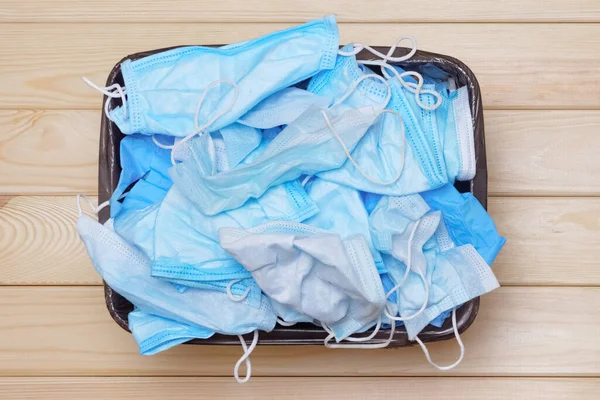 Throw Away Used Mask. Discarded surgical masks. Trash Bin with Medical ...