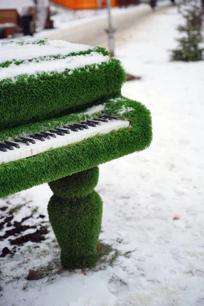 Close up of decorative piano on street in wintertime. Installation of ...