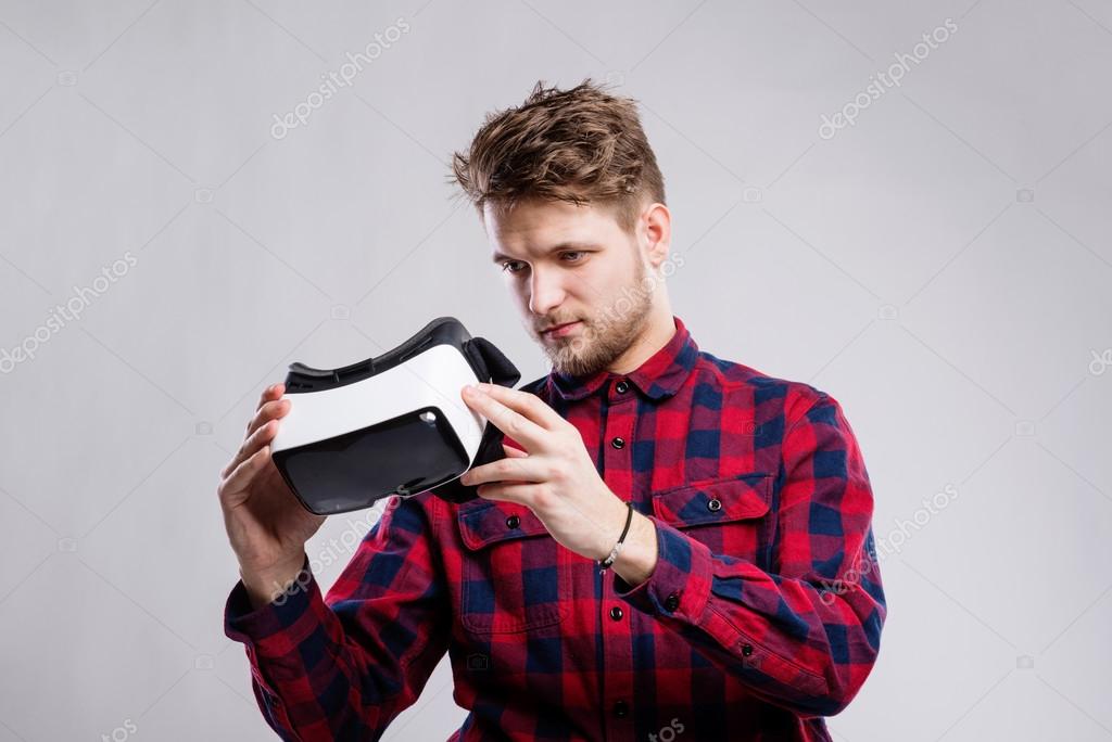 Man with virtual reality goggles. Stock Photo by ©halfpoint 102733462