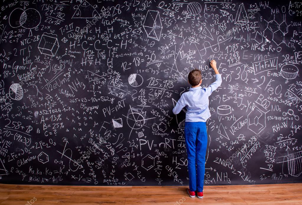 Boy against big blackboard with mathematical symbols and formula Stock ...