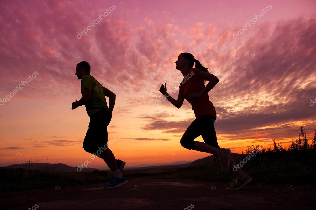 Couple running in sunset — Stock Photo © halfpoint #52373343