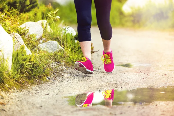 Senior runner woman's feet running - Stock Image - Everypixel