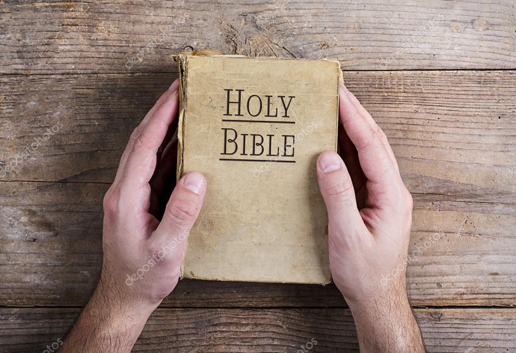 Hands holding Bible Stock Photo by ©halfpoint 66354543