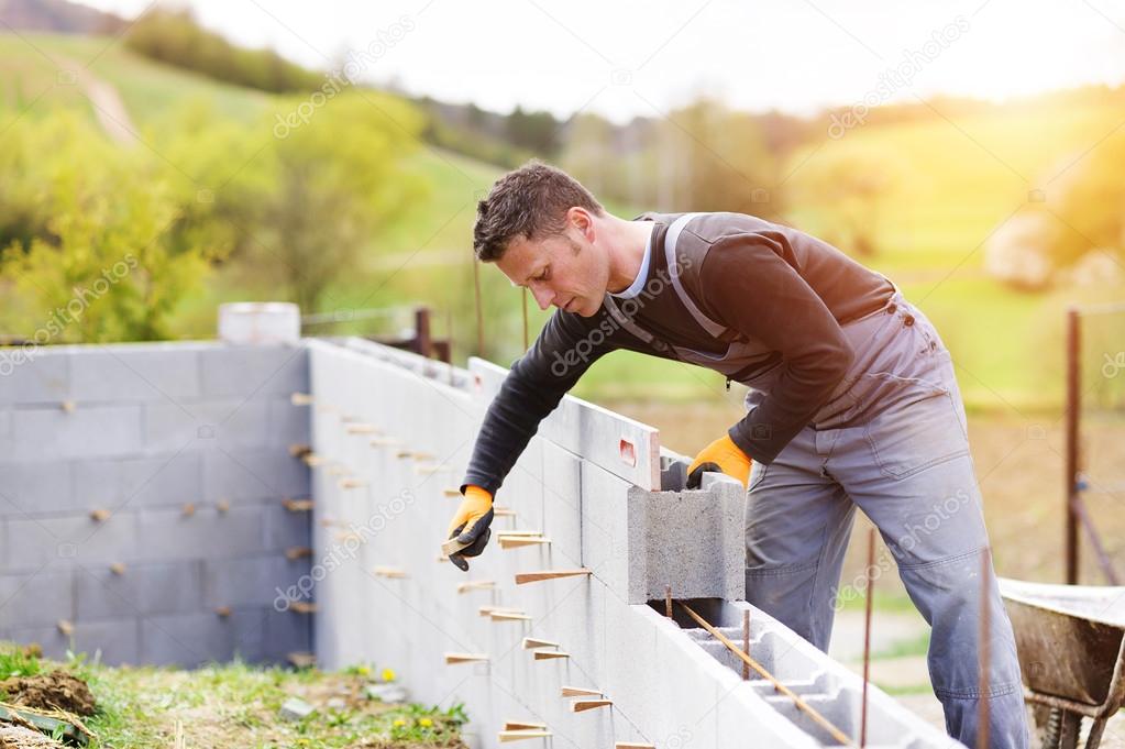 Man building a house — Stock Photo © halfpoint #72071737