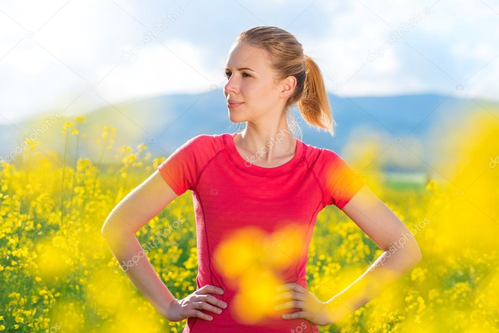 Beautiful runner in spring canola field Stock Photo by ©halfpoint 74780141