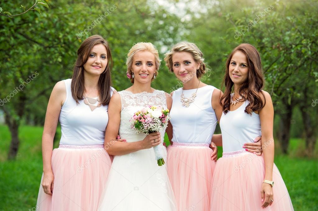 Bride with bridesmaids at wedding — Stock Photo © halfpoint #95374602