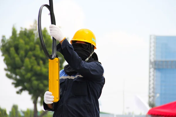 Remote handle by worker - Stock Image - Everypixel