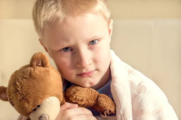 Sad injured little boy — Stock Photo © Jaykayl #11680292