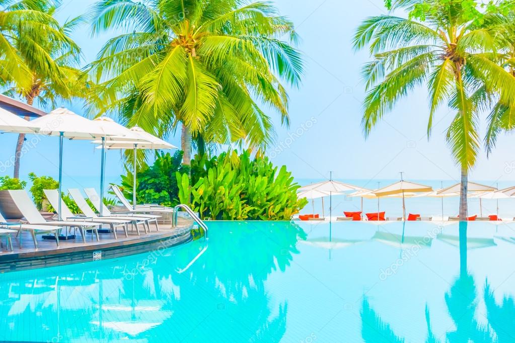 Beautiful luxury swimming pool Stock Photo by ©mrsiraphol 100267224