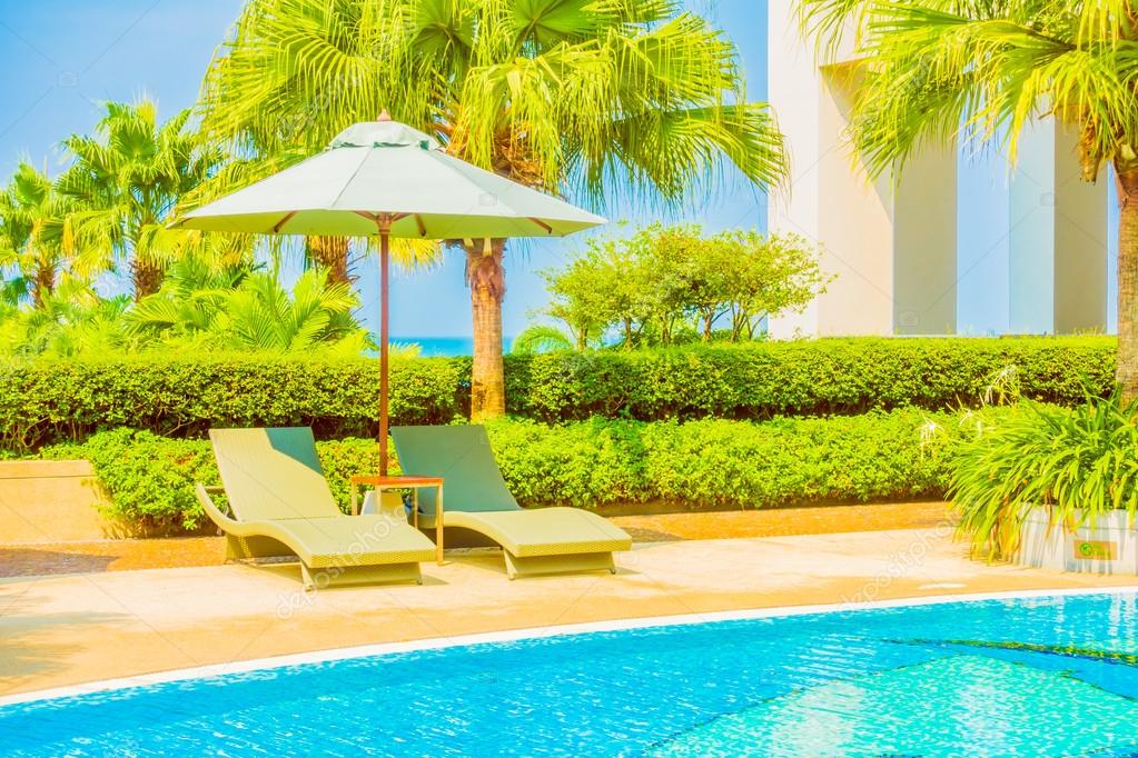 Beautiful luxury swimming pool Stock Photo by ©mrsiraphol 100798488