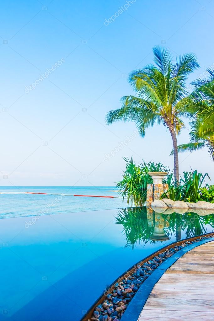 Luxury swimming pool landscape Stock Photo by ©mrsiraphol 103197628