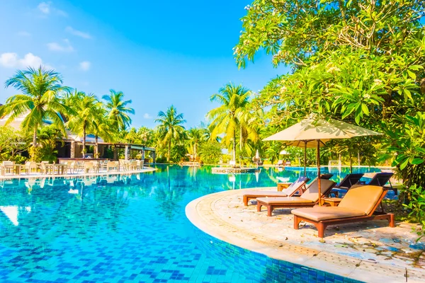 Outdoor swimming pool in hotel resort — Stock Photo © mrsiraphol #108904046