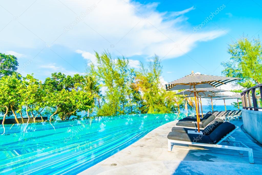 Outdoor swimming pool Stock Photo by ©mrsiraphol 113409998